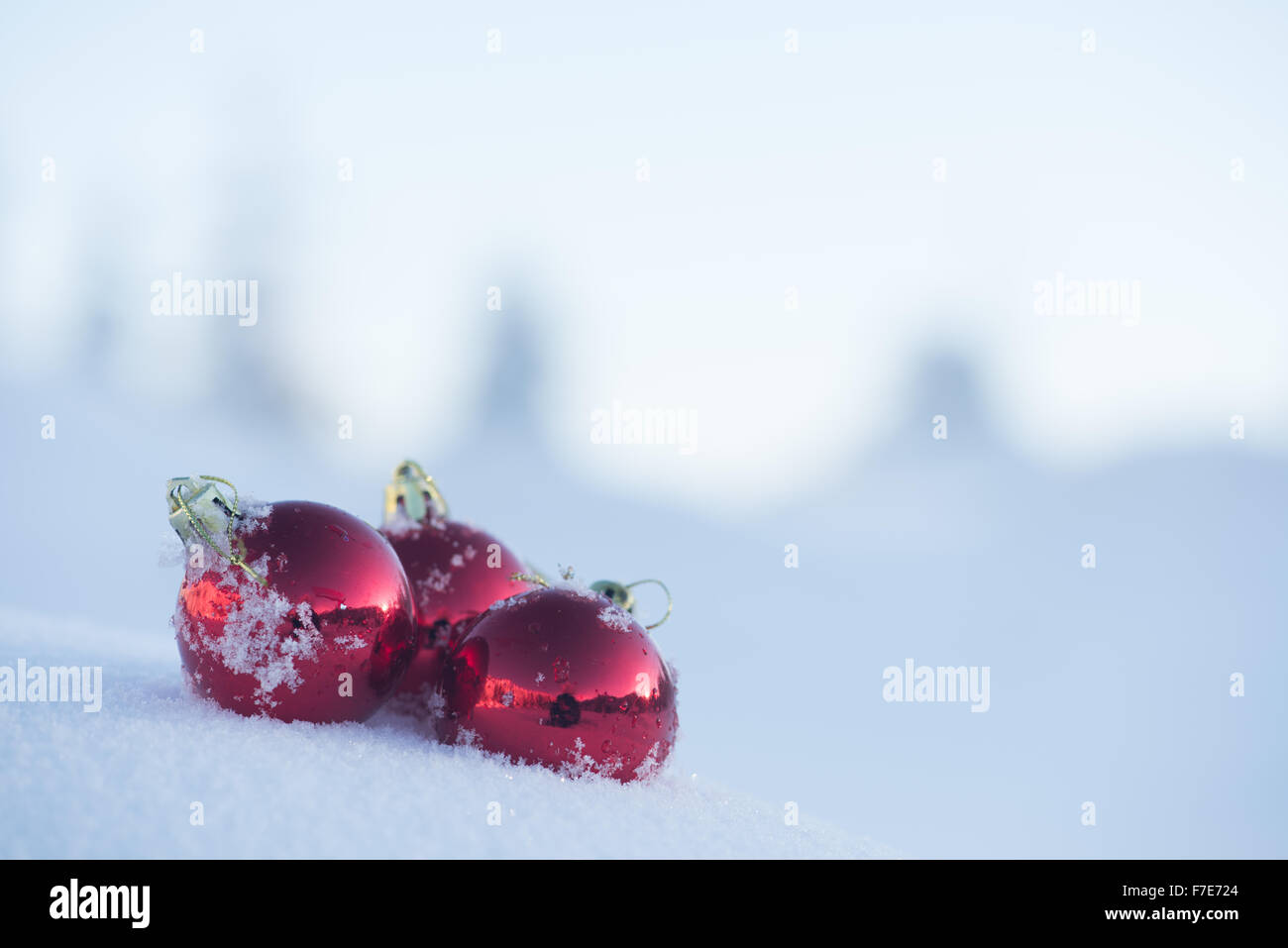 christmas red balls decoration in fresh snow background on beautiful ...