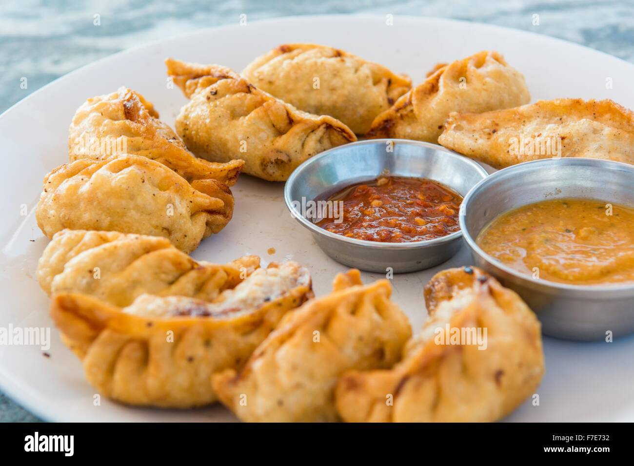 Deep frying spicy momos hi-res stock photography and images - Alamy