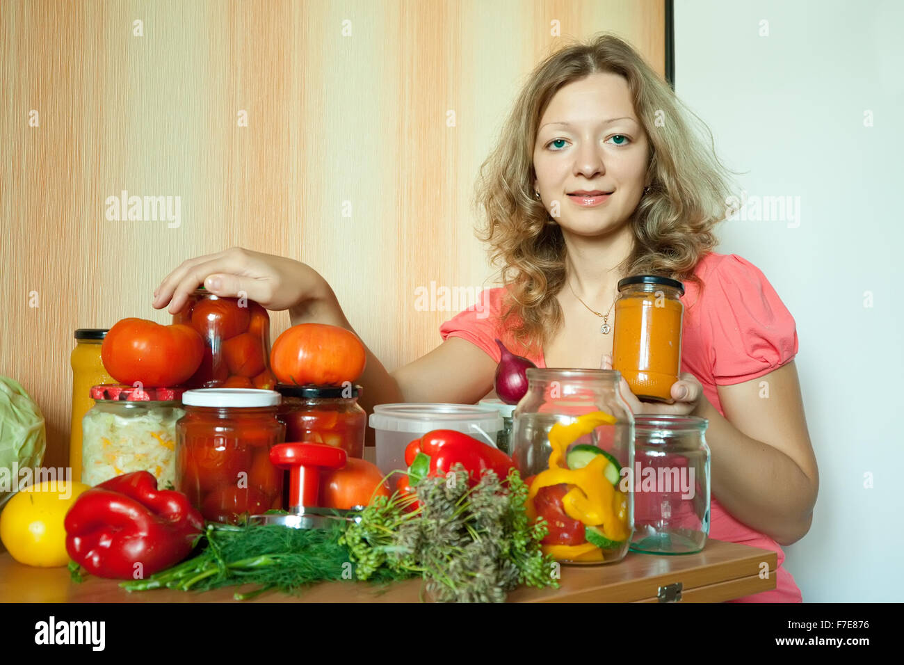 Woman marinating vegetables in the kitchen Stock Photo - Alamy