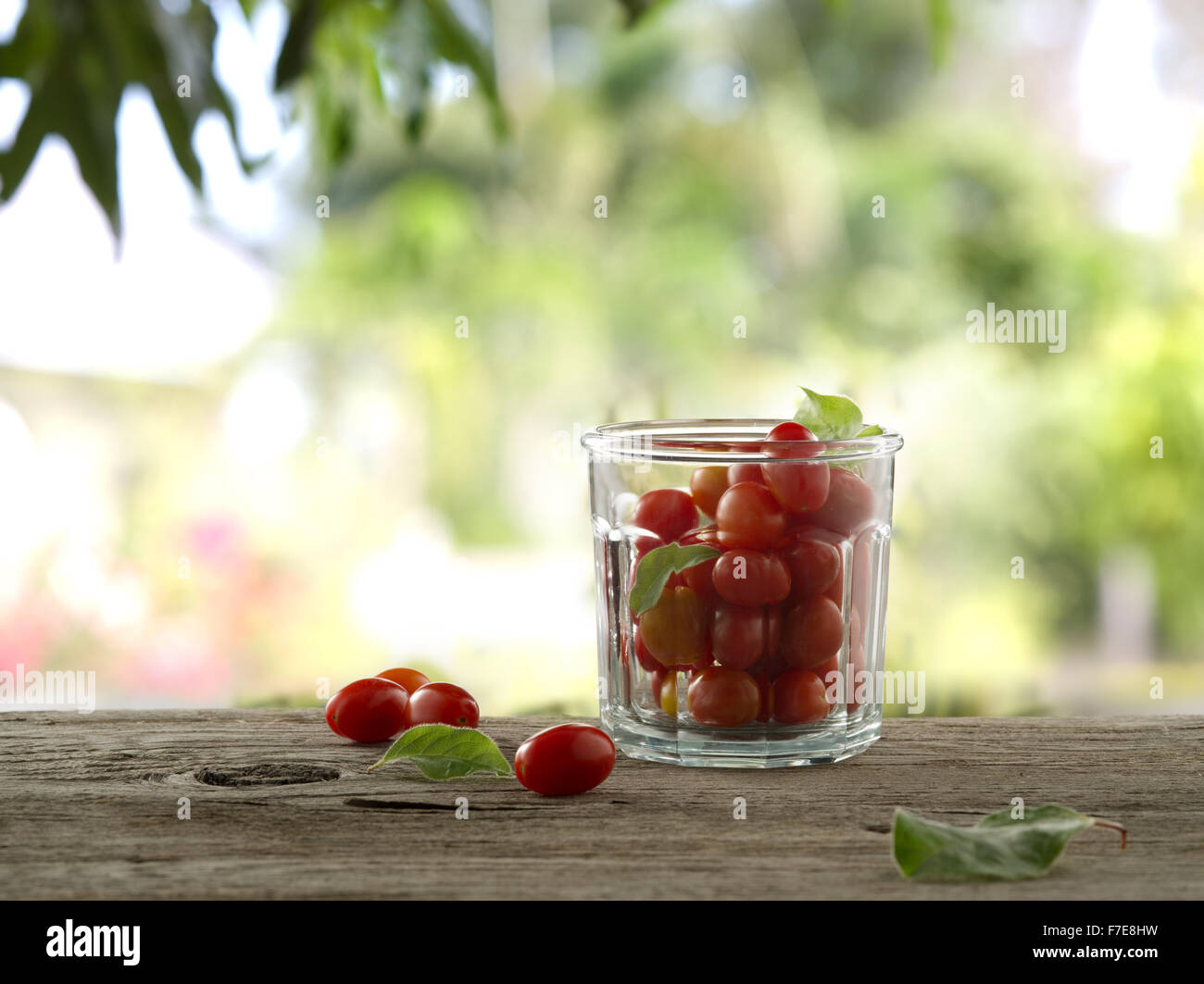 close up view of nice fresh cherry tomatoes on wooden table Stock Photo ...