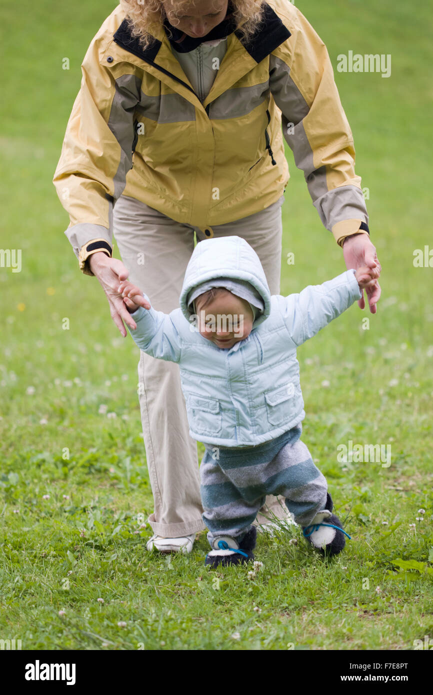 First steps with grandmother Stock Photo - Alamy