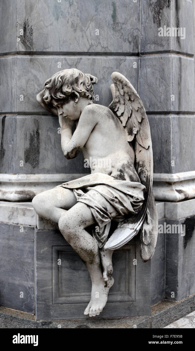 statue of a boy angel at La Recoleta cemetery Buenos Aires, Argentina ...