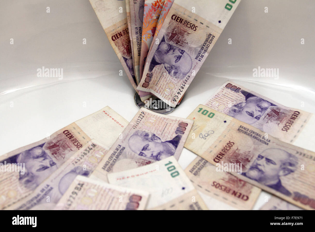 Argentinian peso pesos going down the drain. Inflation devaluation ...