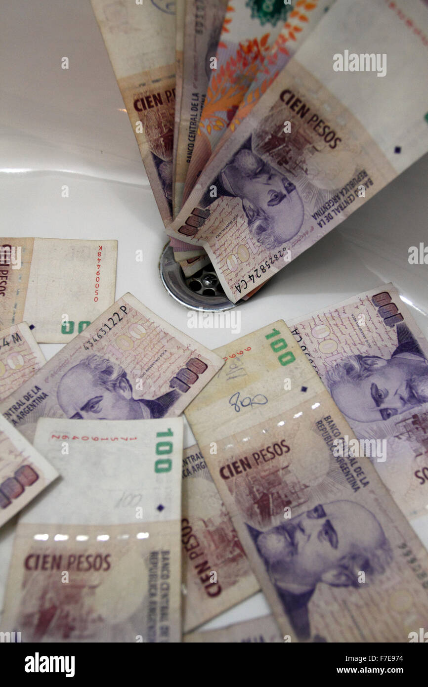 Argentinian peso pesos going down the drain. Inflation devaluation ...