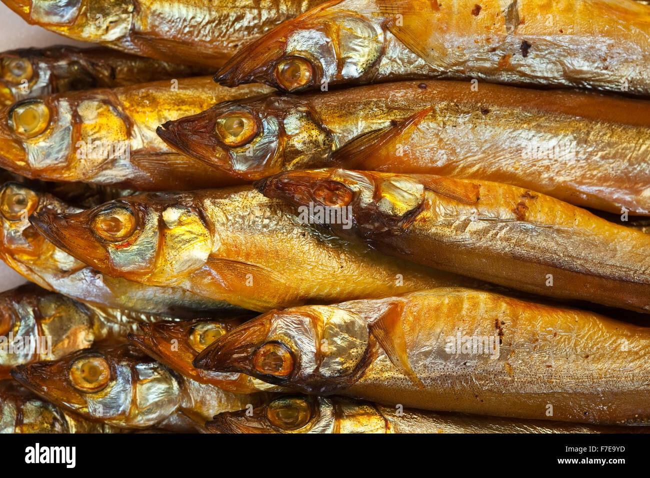 background of golden smoke-dried fish close up Stock Photo - Alamy