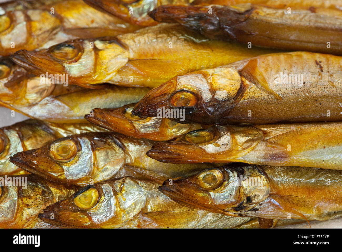 background of golden smoke-dried fish close up Stock Photo - Alamy