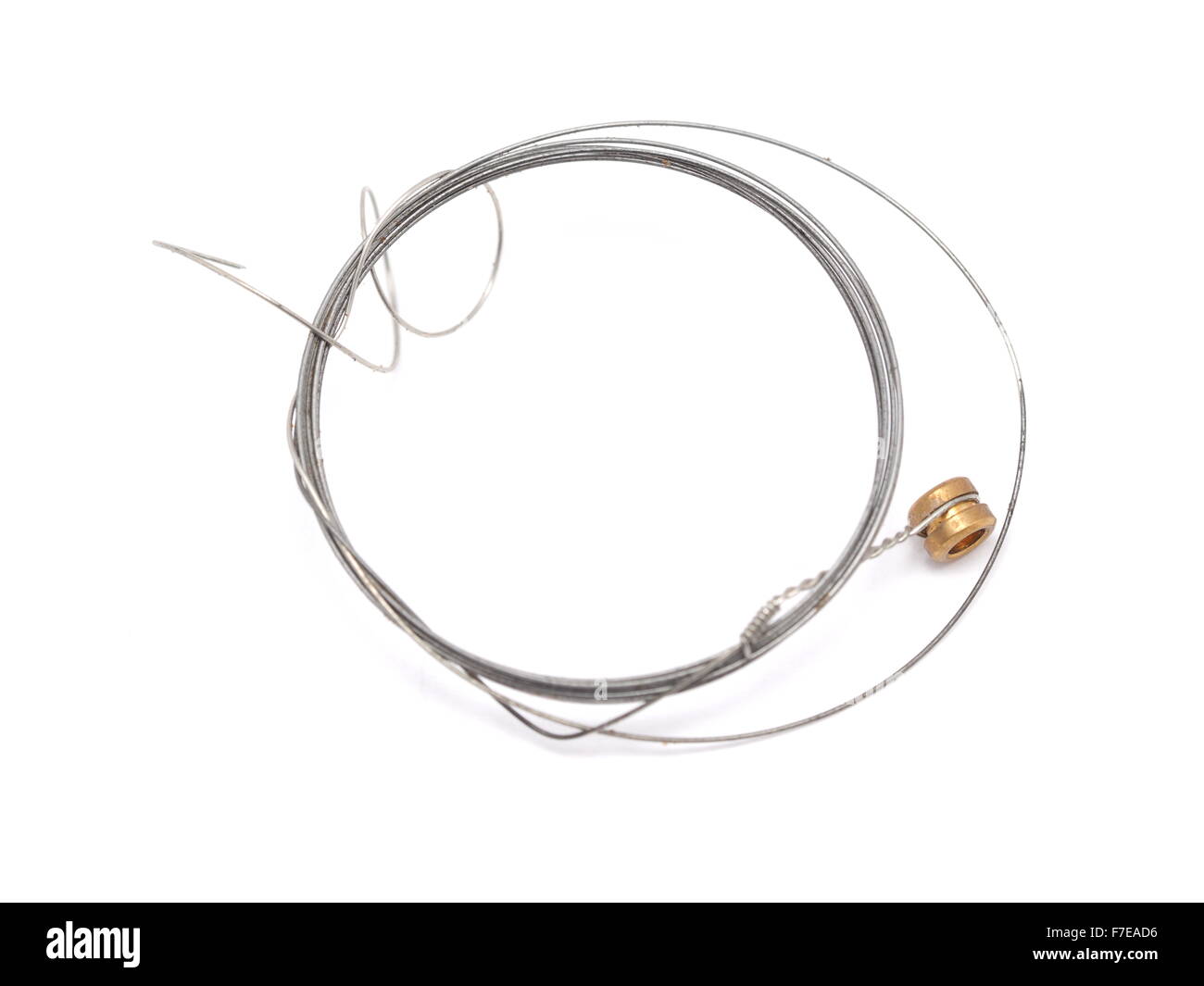 old guitar string on a white background Stock Photo - Alamy