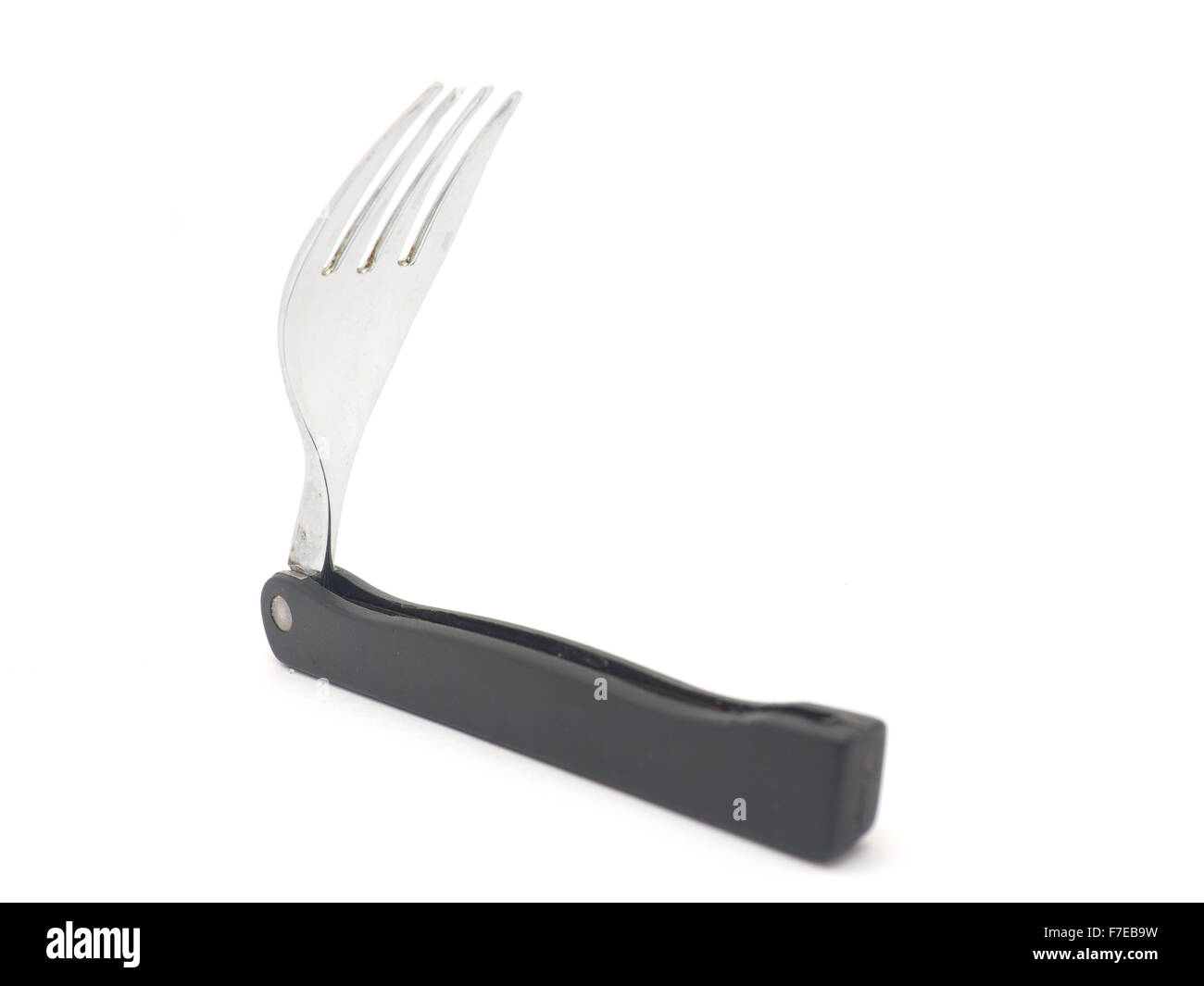 Folding travel fork on a white background Stock Photo - Alamy