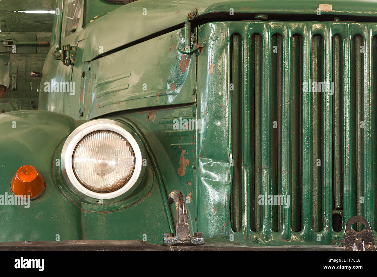 front of old green lorry with grille and reflector Stock Photo - Alamy