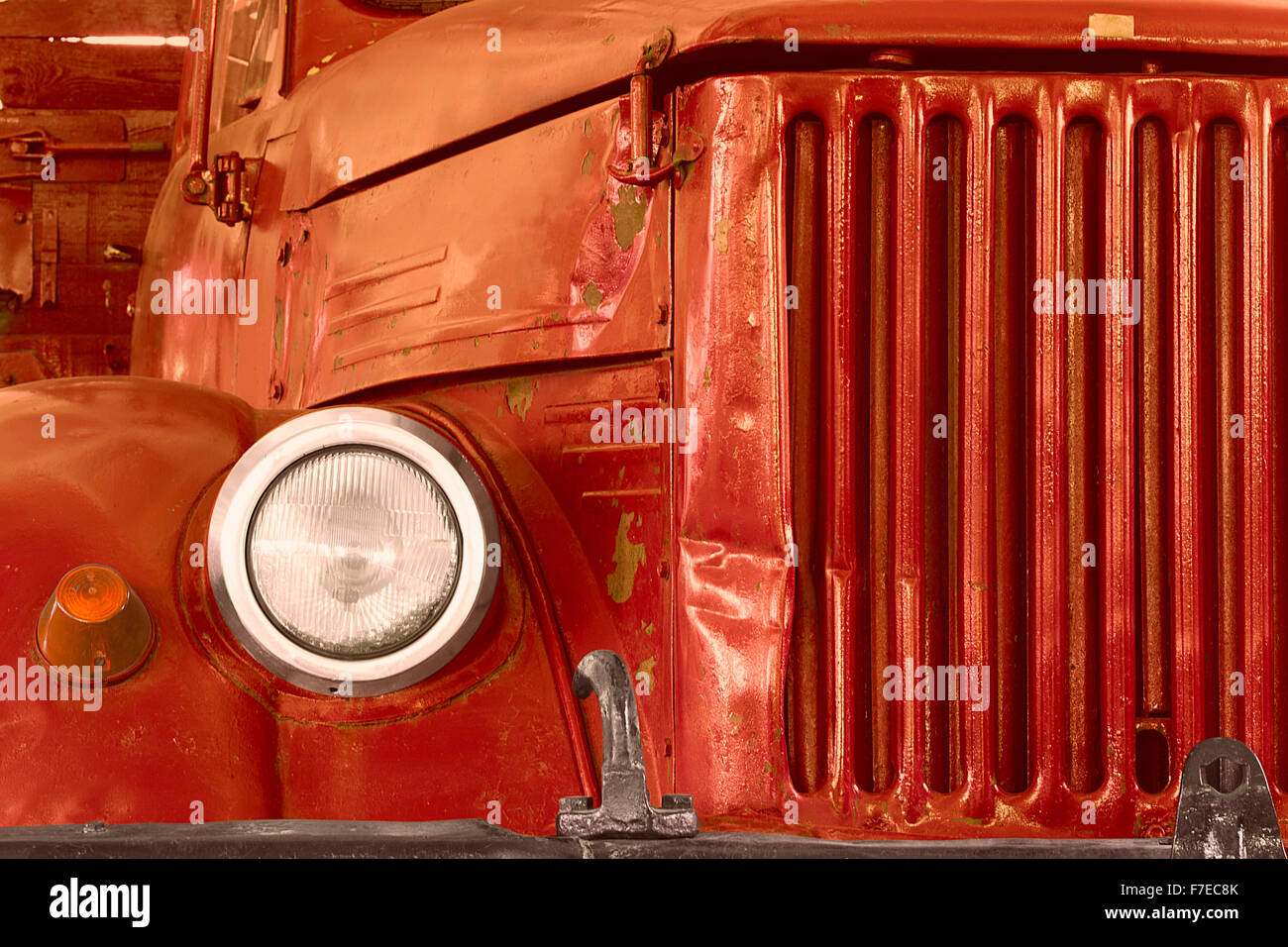 front of old red lorry with grille and reflector Stock Photo - Alamy