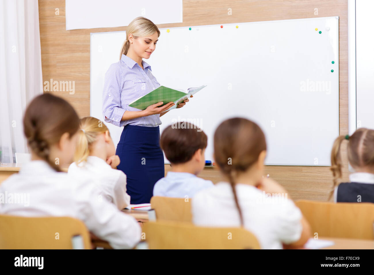 Teacher is busy reading out loud Stock Photo - Alamy