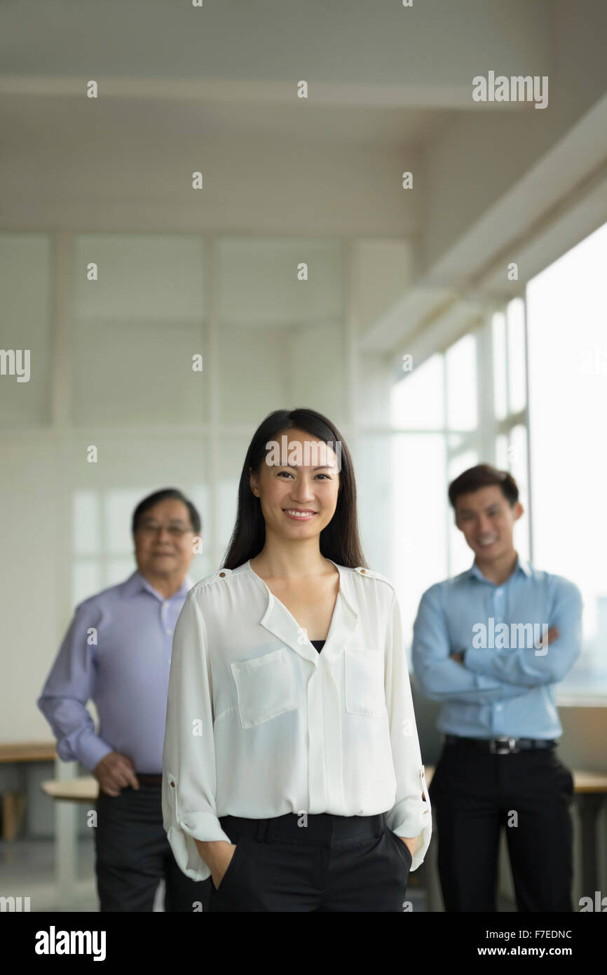 Singapore, Three business people in office Stock Photo - Alamy