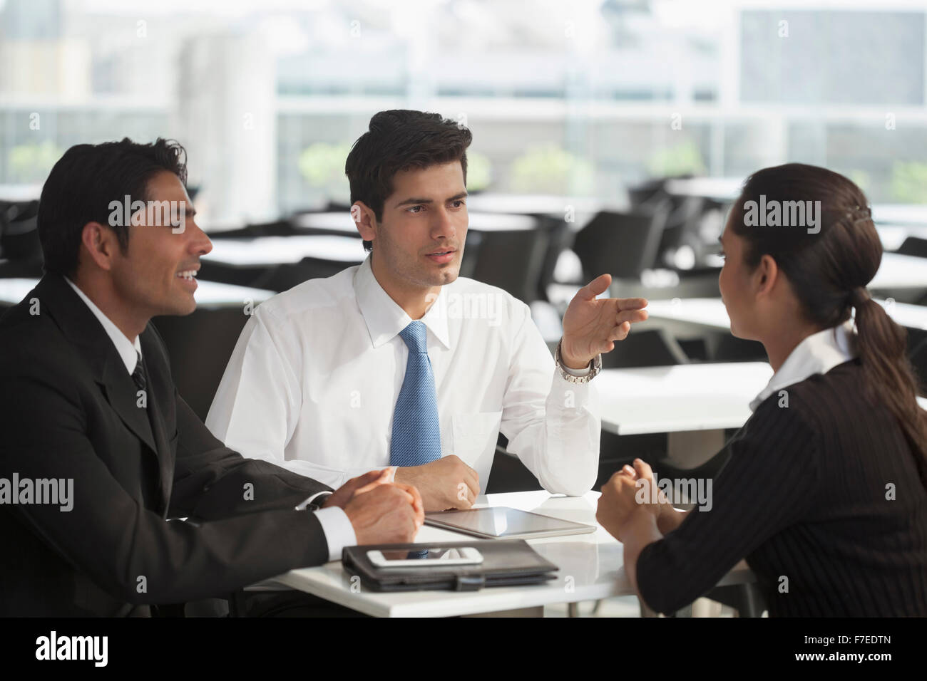 India, Group discussion with two men and one woman Stock Photo - Alamy