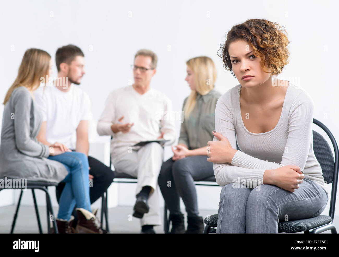 Psychologist working with group of people Stock Photo - Alamy