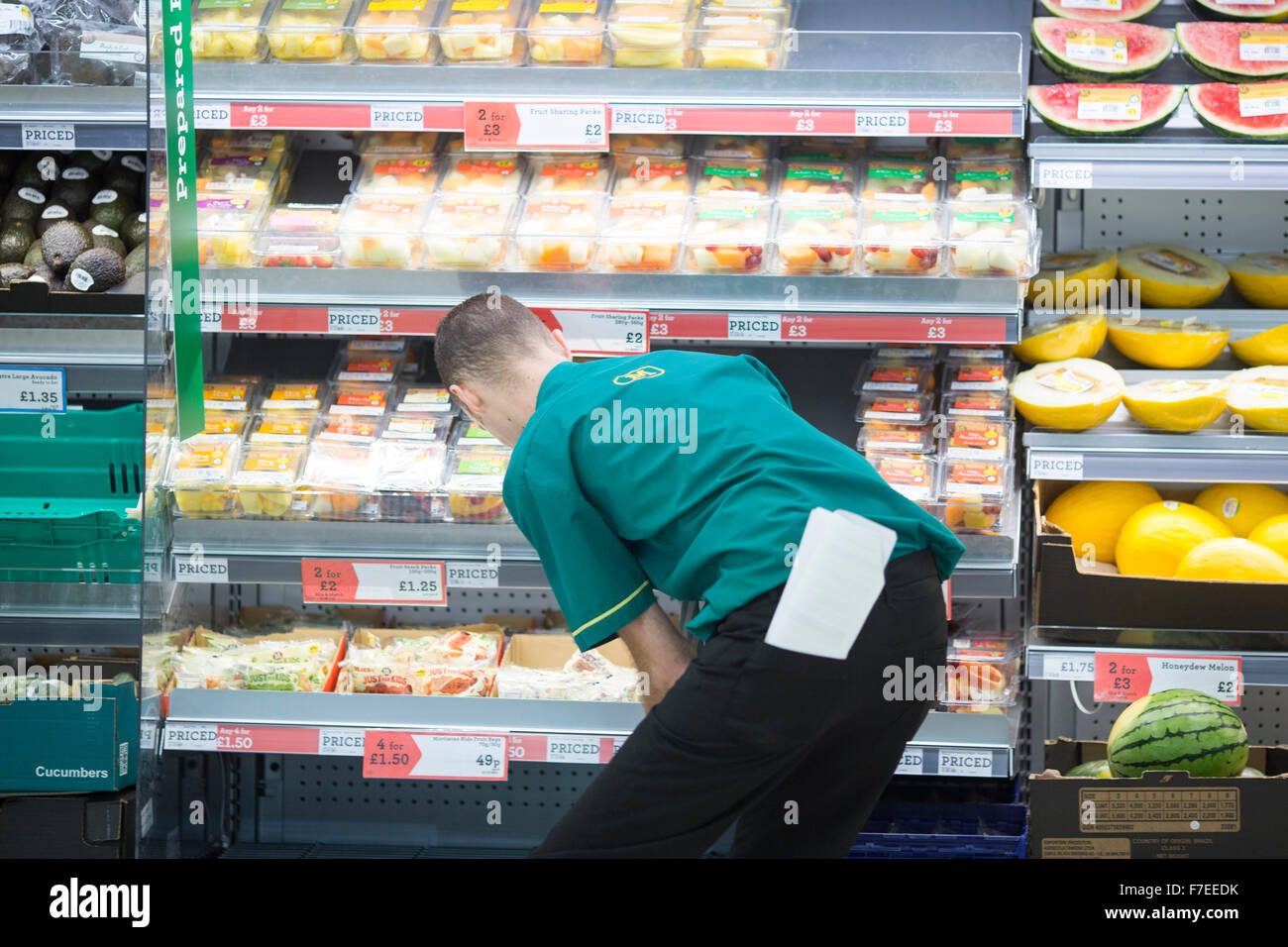 a man stacks a display in a Morrisons supermarket Stock Photo - Alamy