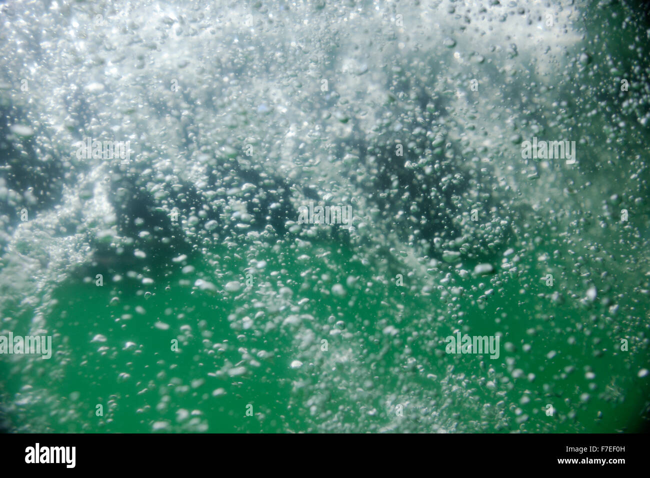 fresh water bubbles splash with green background Stock Photo - Alamy
