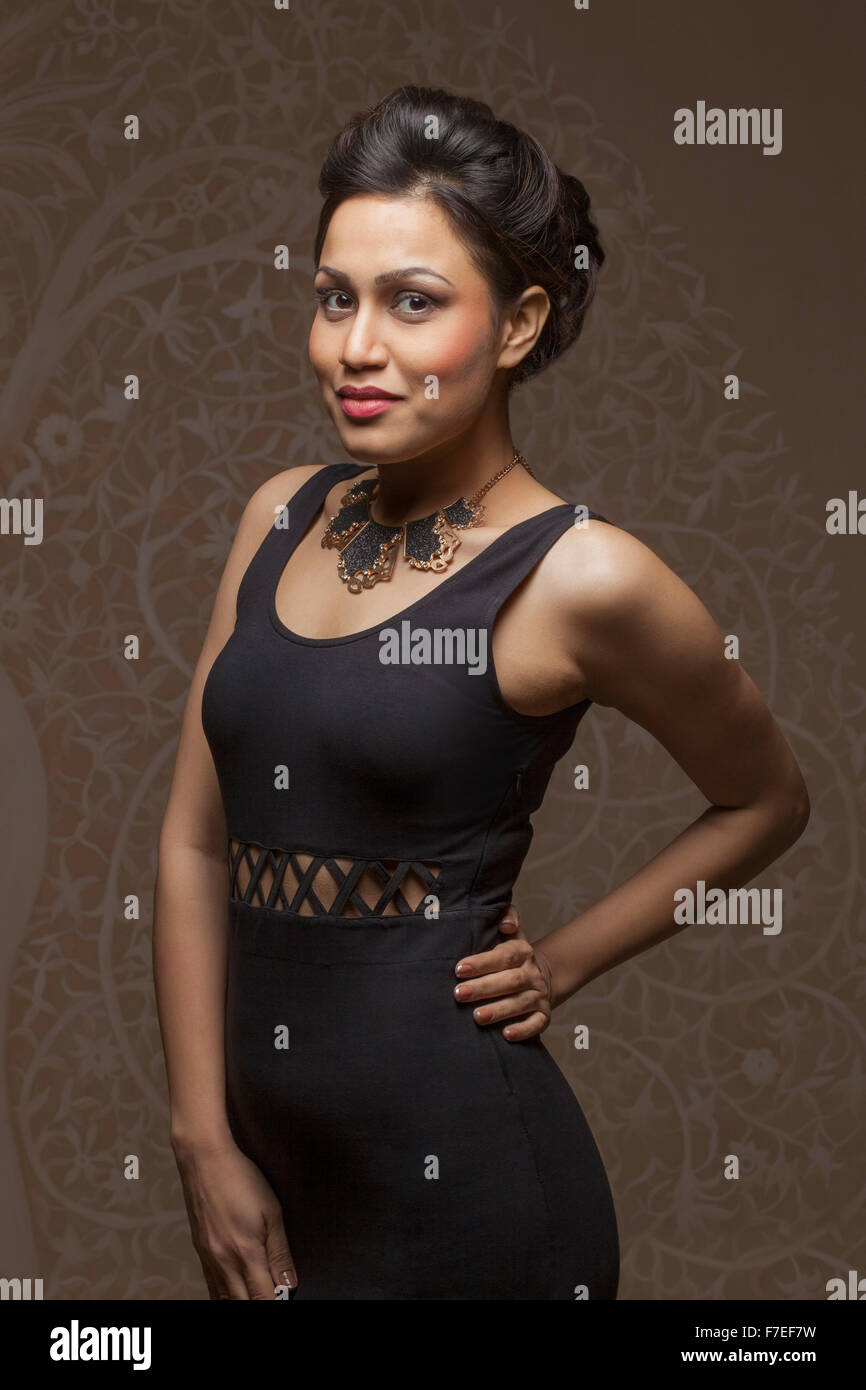 Woman with hand on hip black dress hi-res stock photography and images ...