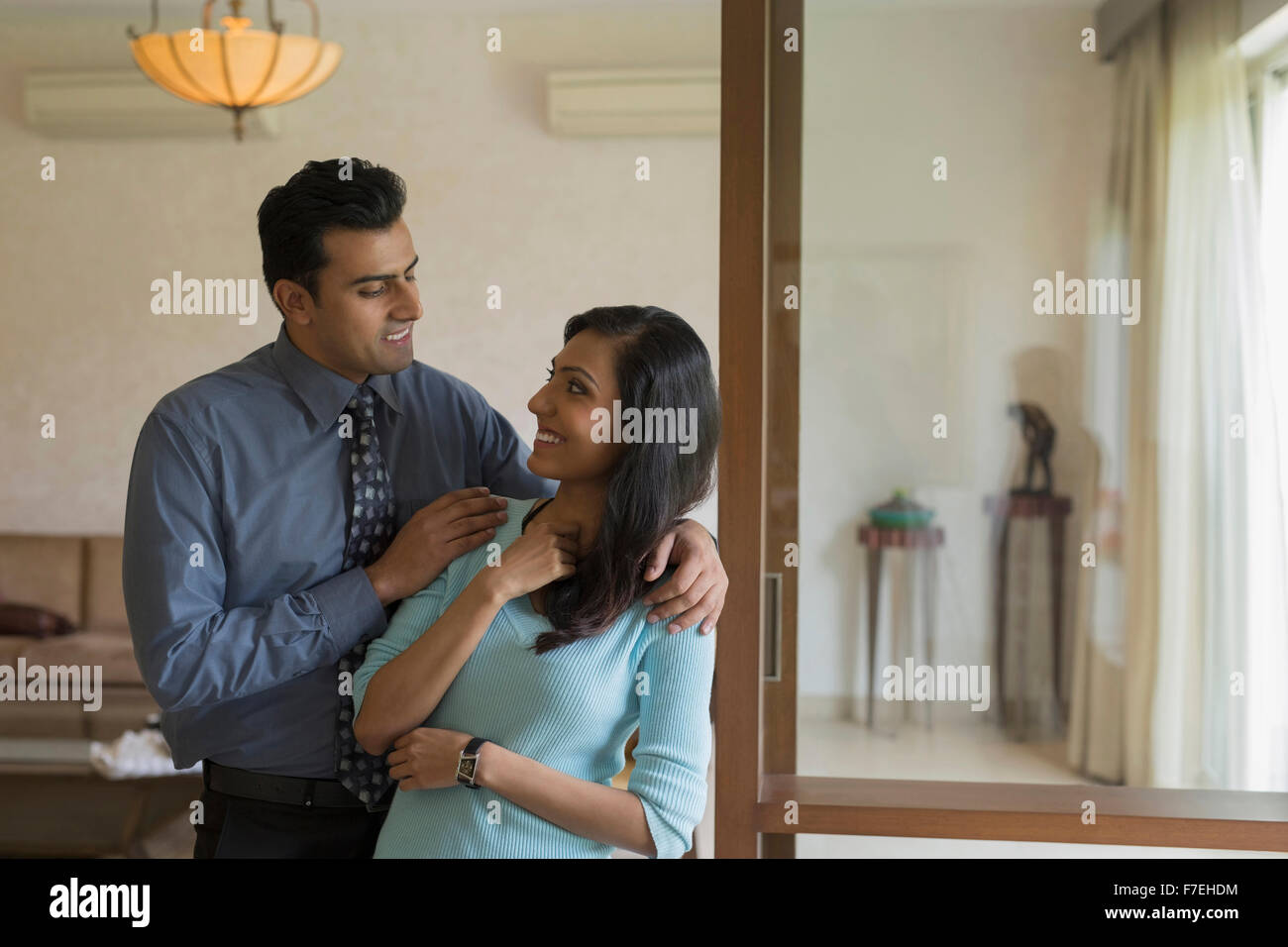 Man embracing woman, smiling Stock Photo - Alamy