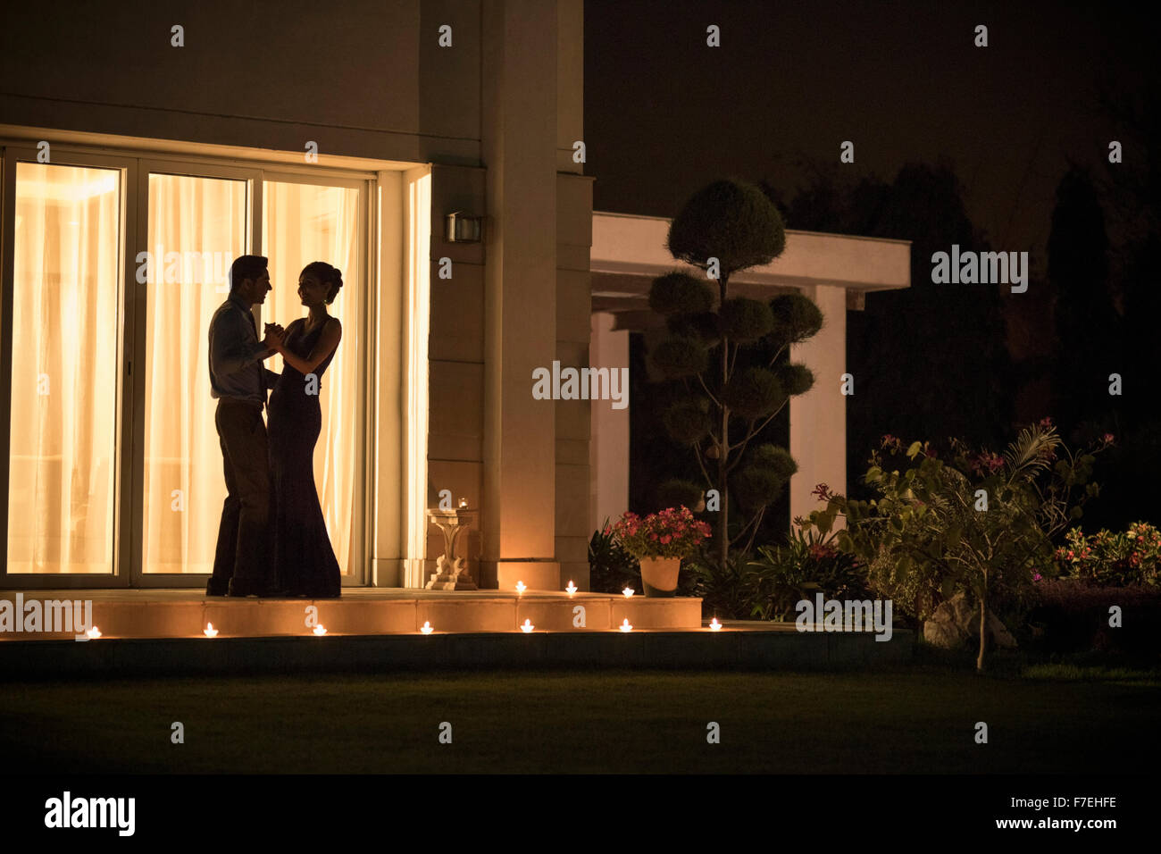 Man outside house night hi-res stock photography and images - Alamy