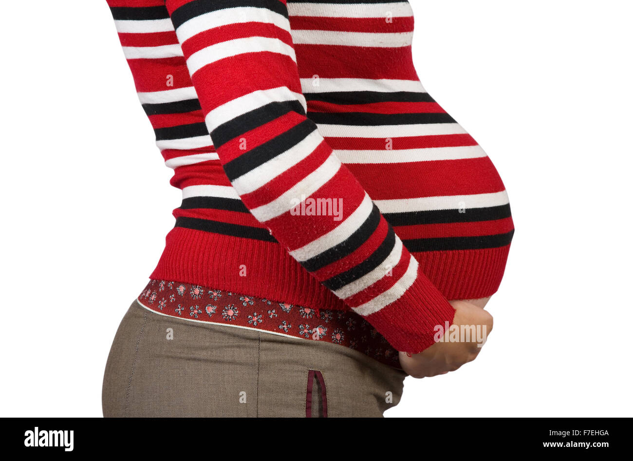 Belly of 9 months pregnant woman over white Stock Photo - Alamy
