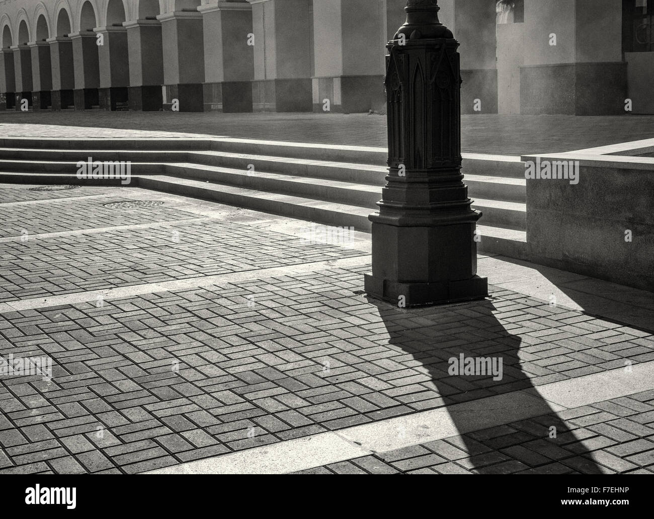 Single black cast iron lam post in black and white with expressionist ...