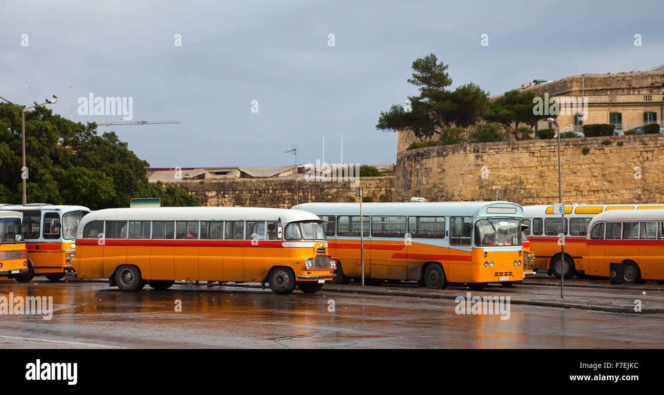 Yellow buses at bus terminal at Valletta. Malta Stock Photo - Alamy