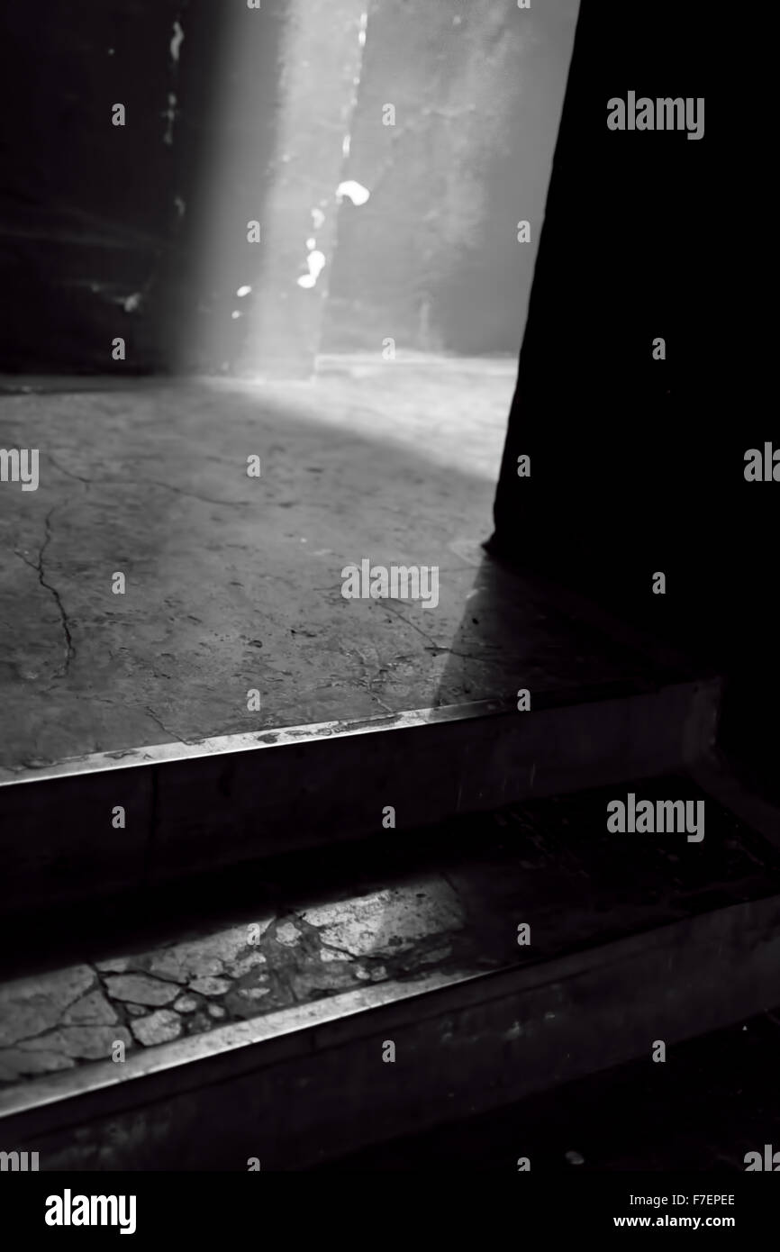 Empty doorway in expressionist style with shadows creates a sense of ...