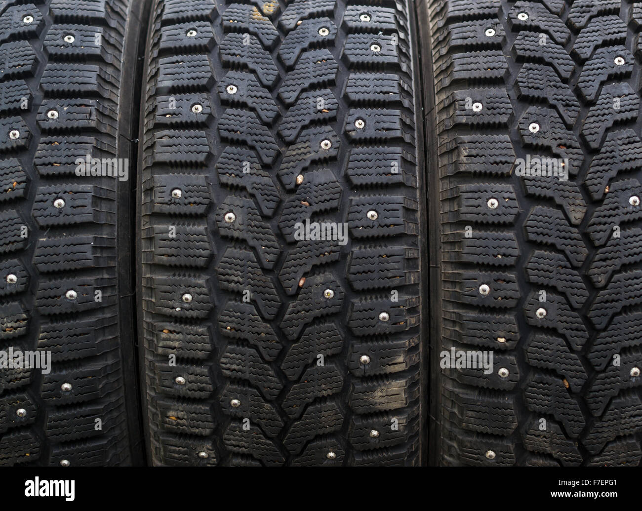 Single row of popular car winter snow tyres with metal spikes for ...