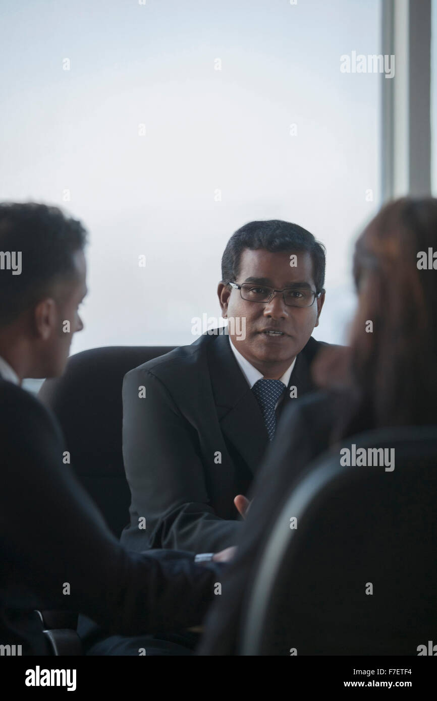 Singapore, Three business people in discussion Stock Photo - Alamy