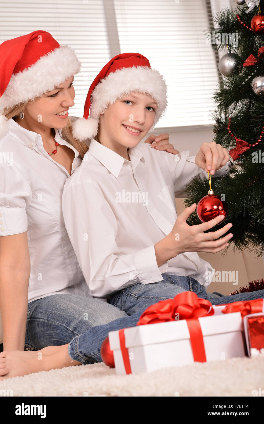 Cute mom and son in santa hats Stock Photo - Alamy