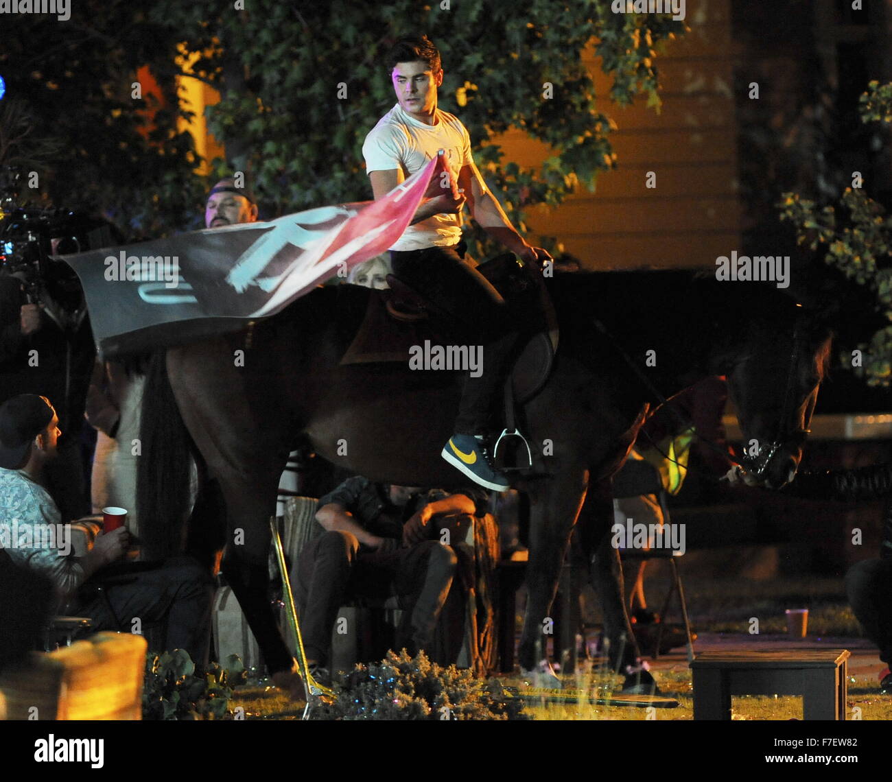 Zac Efron puts on his saddle for a scene in 'Neighbors 2' filming in ...