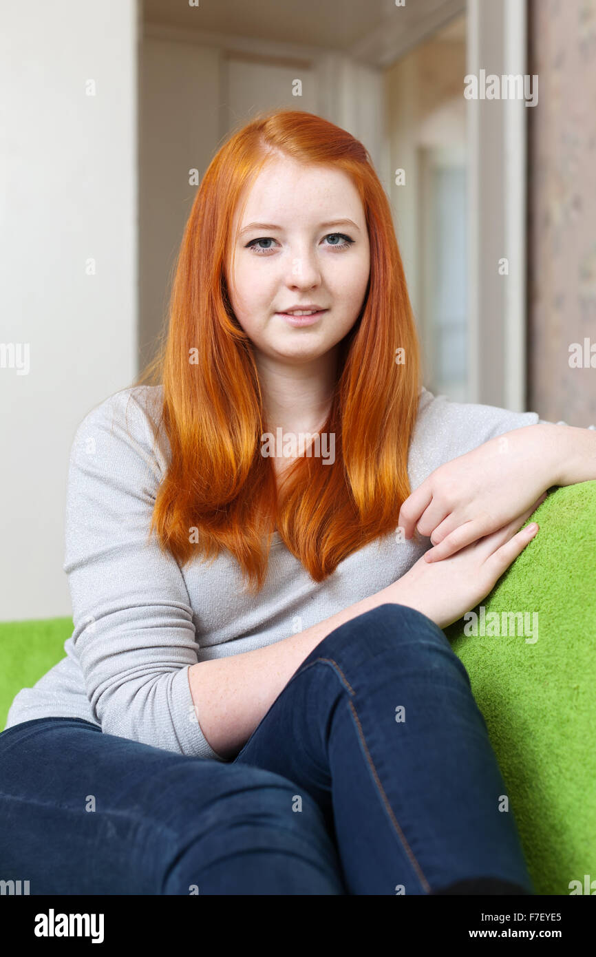 Portrait of ordinary red-haired tenager girl in home interior Stock ...