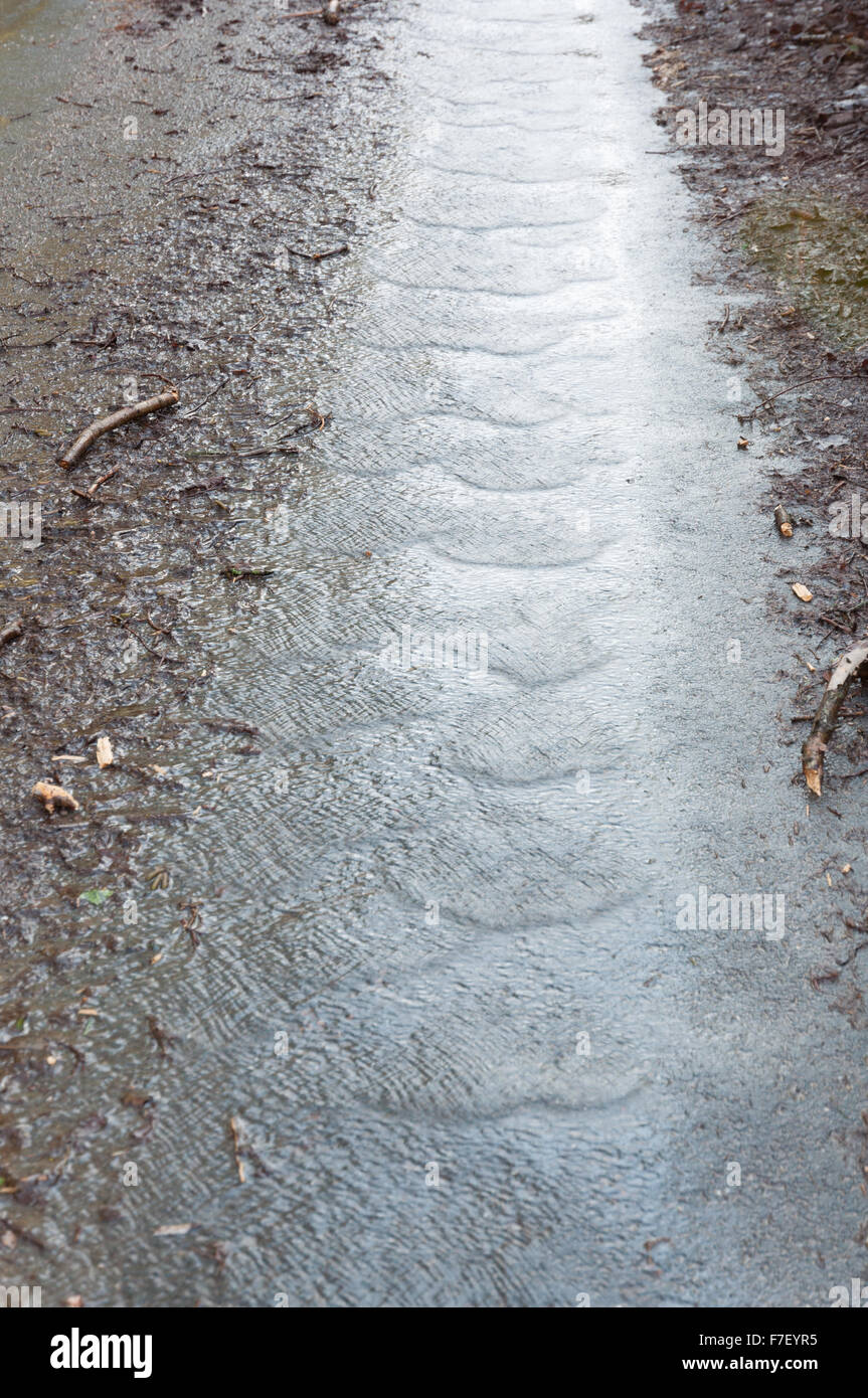 Water flowing in ripples down a lane following heavy rain Stock Photo ...