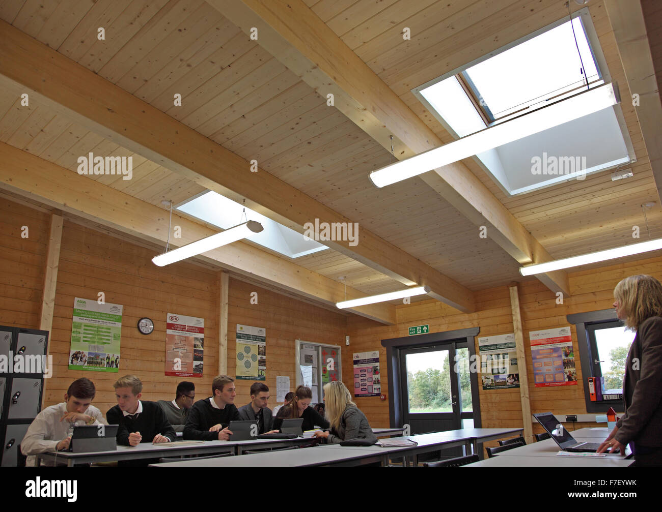 A sixth form IT class in progress in a new school built from timber ...