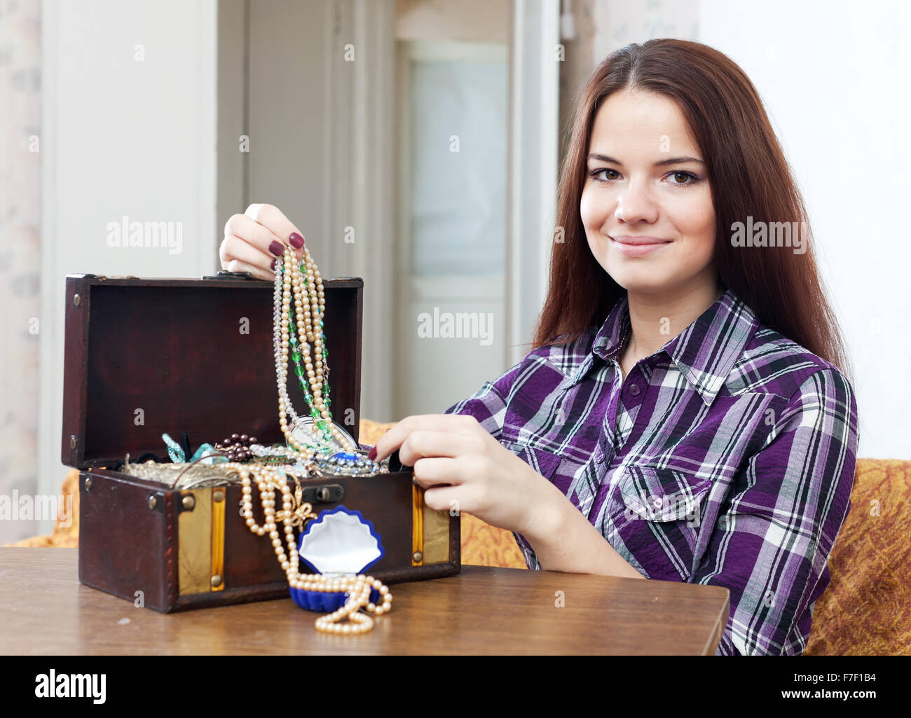 beautiful woman with jewelry in treasure chest Stock Photo - Alamy