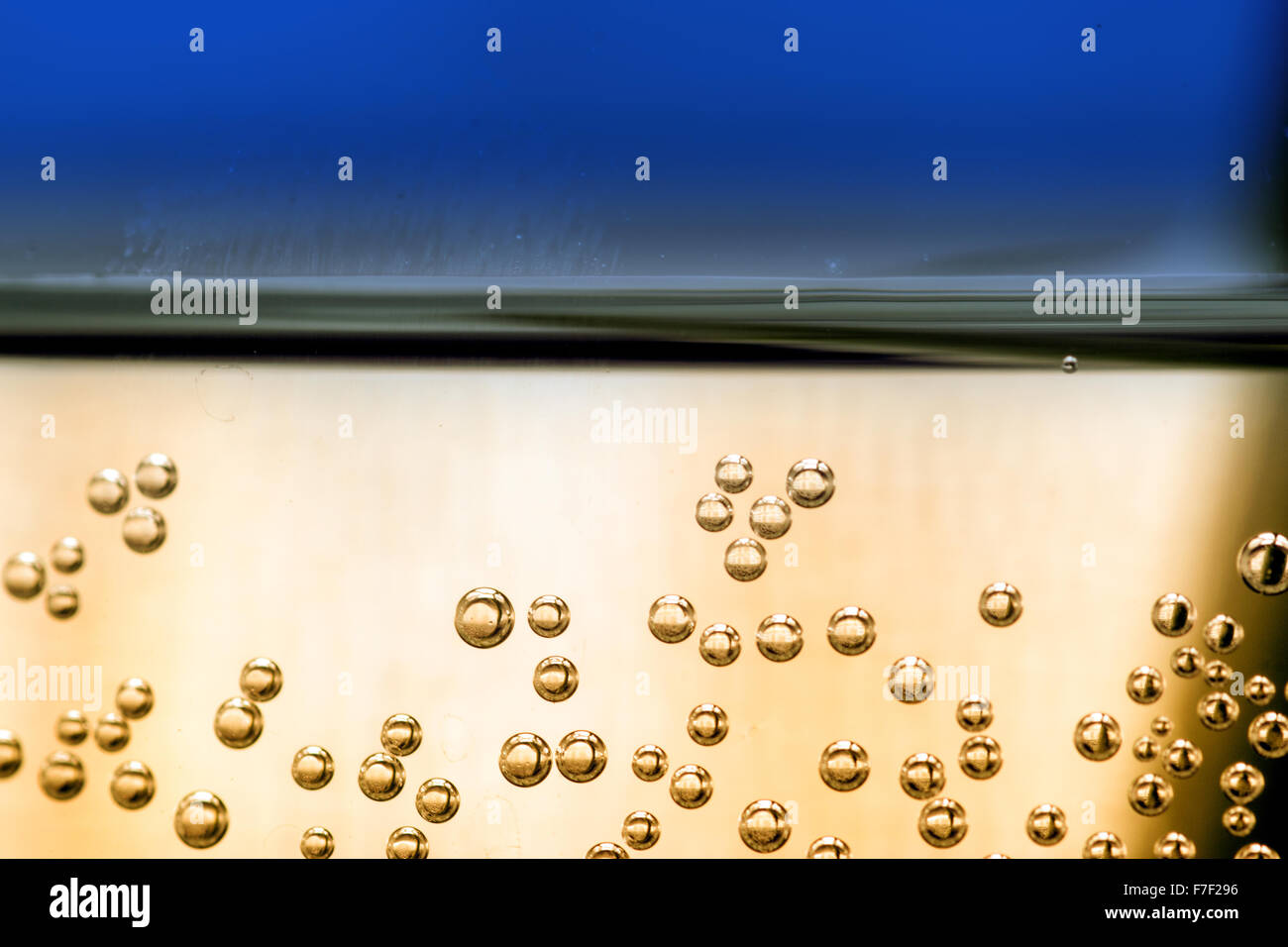 Static bubbles in clear glass with a blue graduated filter Stock Photo ...