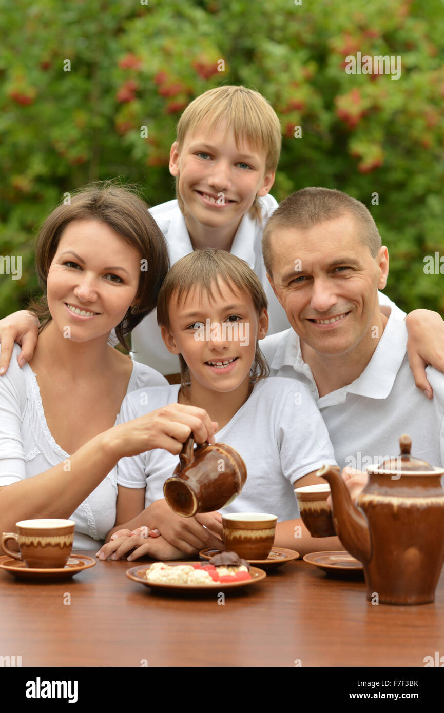 Family drinking tea in garden Stock Photo - Alamy