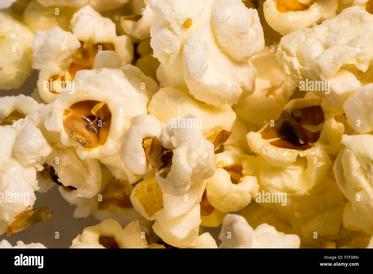 Freshly cooked popcorn in an extreme closeup marco shot showing the hot ...