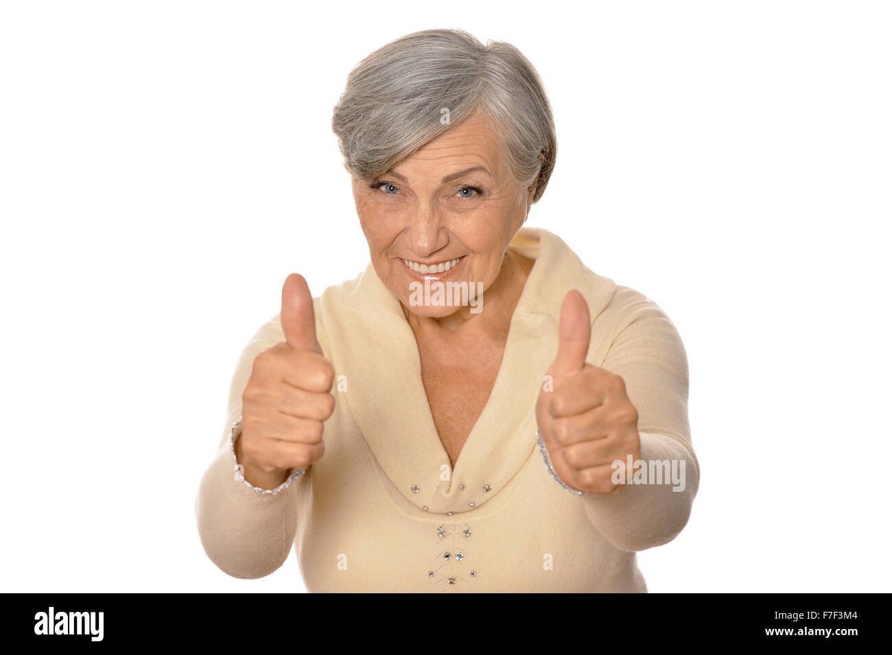 Portrait of elderly woman showing thumbs up Stock Photo - Alamy