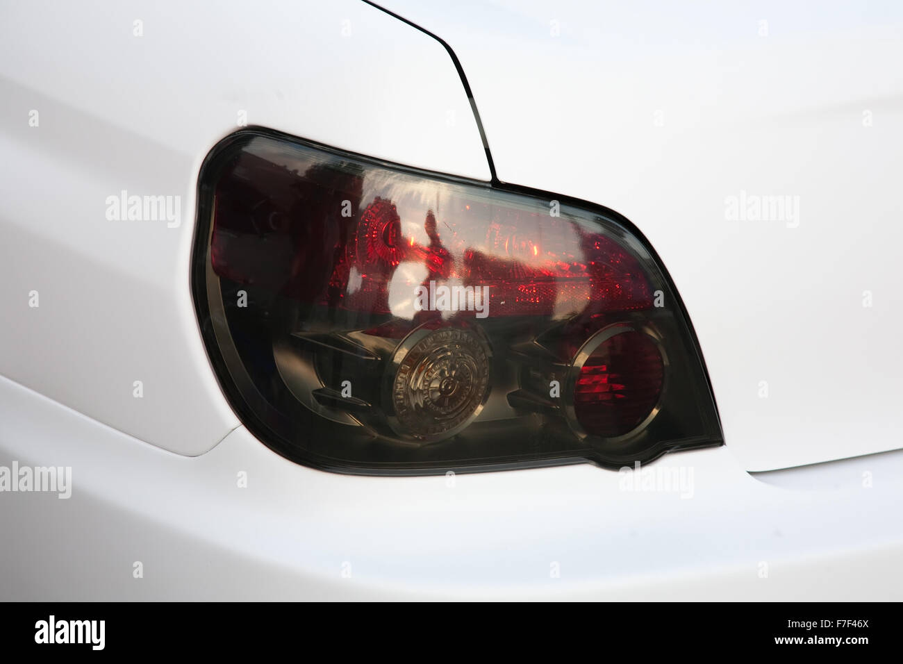 Closeup of Stoplight of modern white car Stock Photo - Alamy