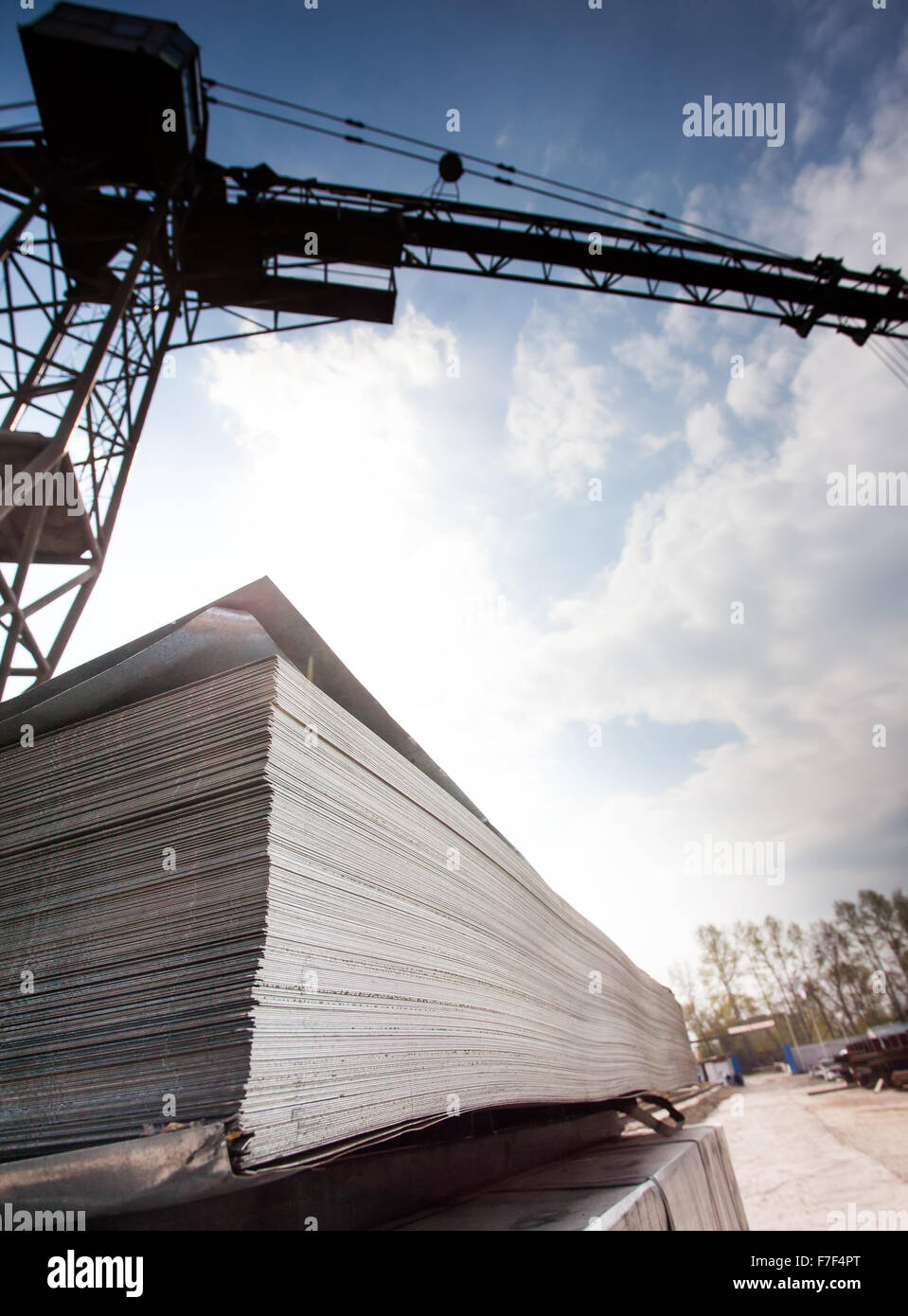 Crane and stack of steel plates Stock Photo - Alamy