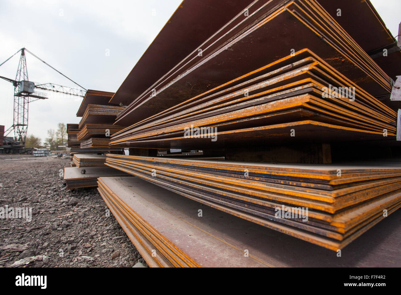 Crane and stack of steel plates Stock Photo - Alamy