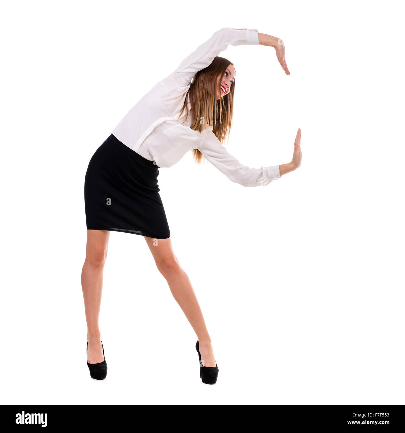 Full length of beautiful business woman standing over isolated white ...