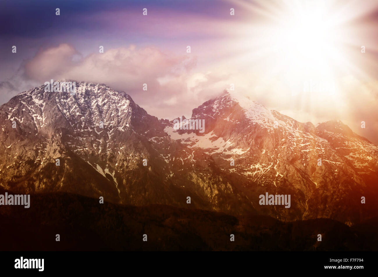 Sun rays over the mountains Stock Photo - Alamy