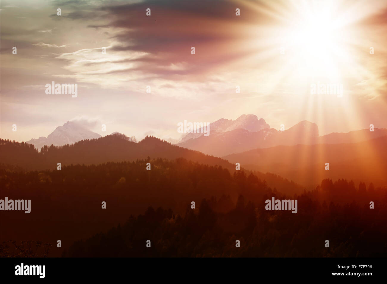 Sun rays over the mountains Stock Photo - Alamy