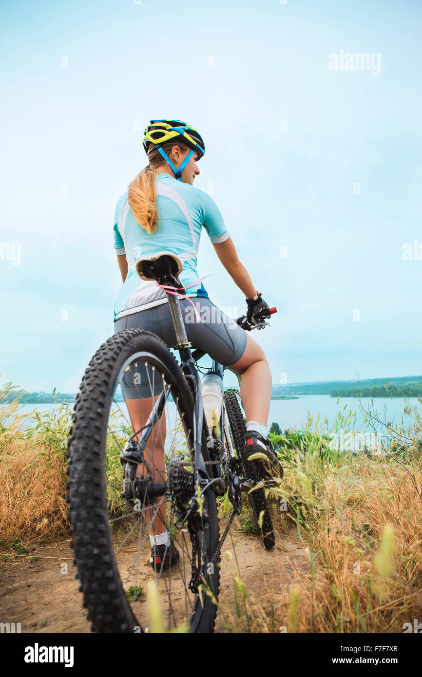 Back view girl riding bicycle hi-res stock photography and images - Alamy