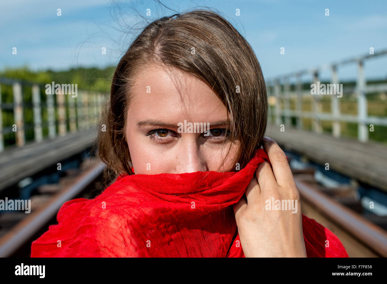 Portrait of girl on a bridge Stock Photo - Alamy