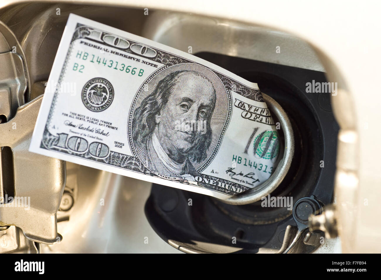 Fuel nozzle with dollar bill hi-res stock photography and images - Alamy