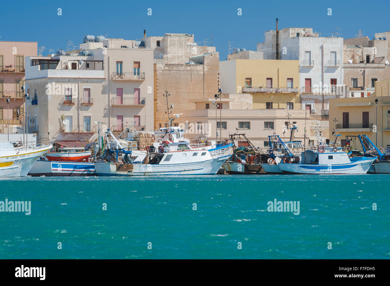 Trapani Sicily port, fishing boats moored in the harbour in Trapani ...