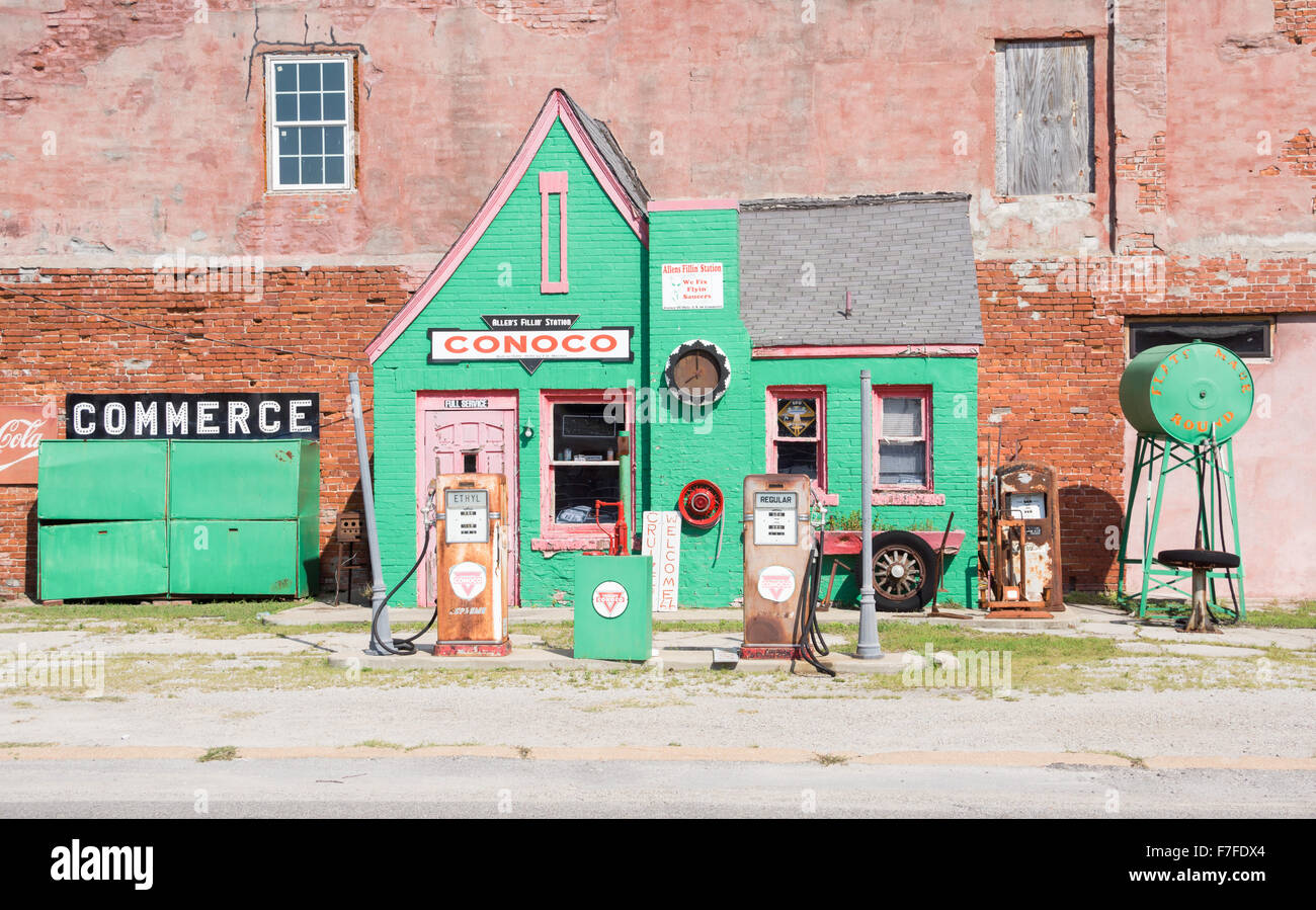 Historic quaint green Conoco garage with rusting pumps no longer in use ...